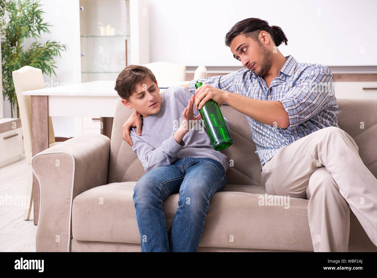 The drunk father and his son Stock Photo - Alamy