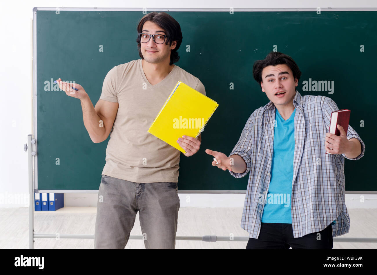 The two male students in the classroom Stock Photo - Alamy