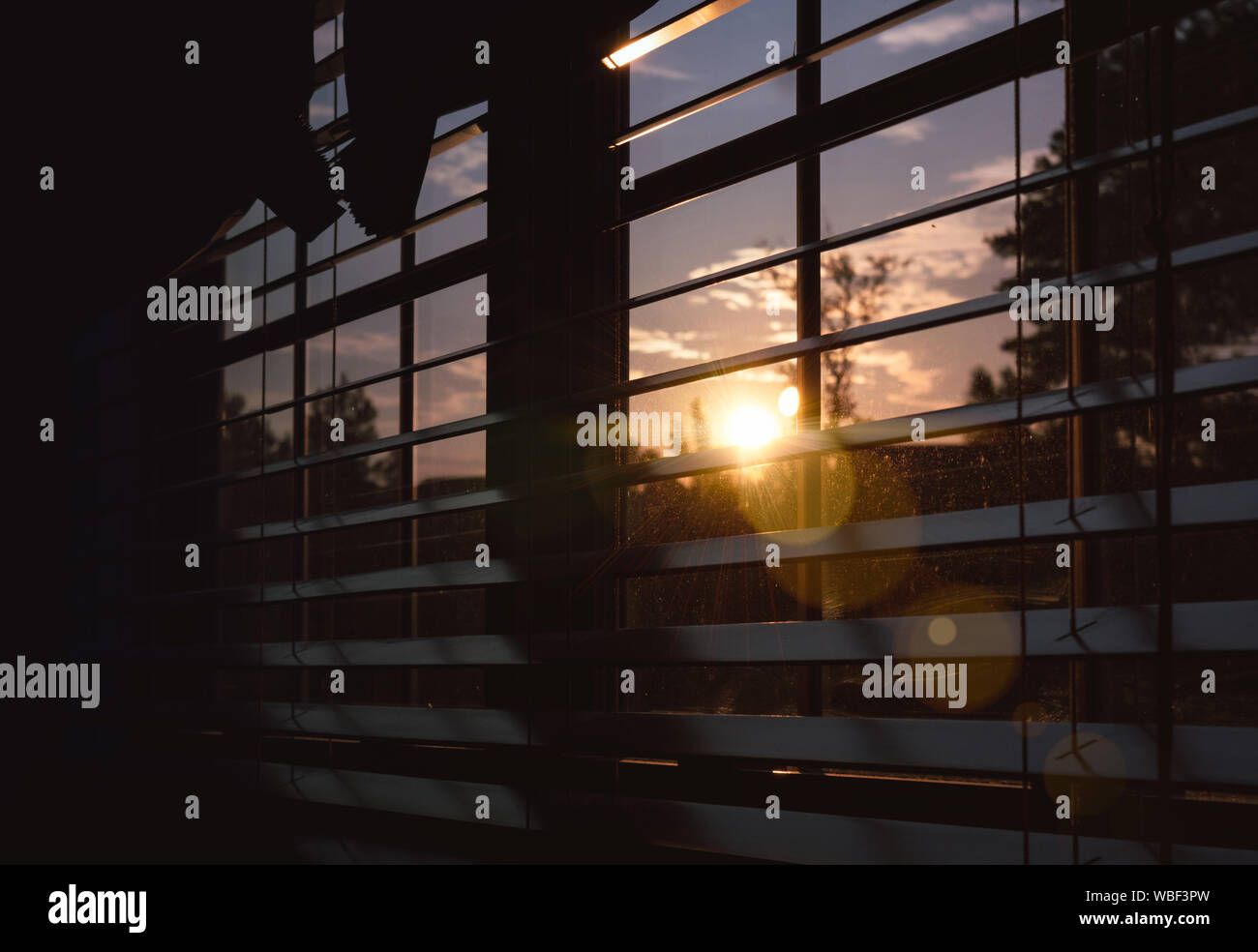 Sun seen by a window with blind curtains Stock Photo - Alamy