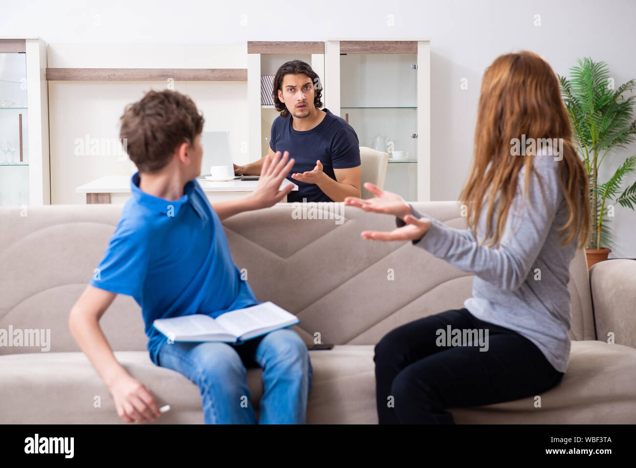 The concept of underage smoking with young boy and family Stock Photo ...