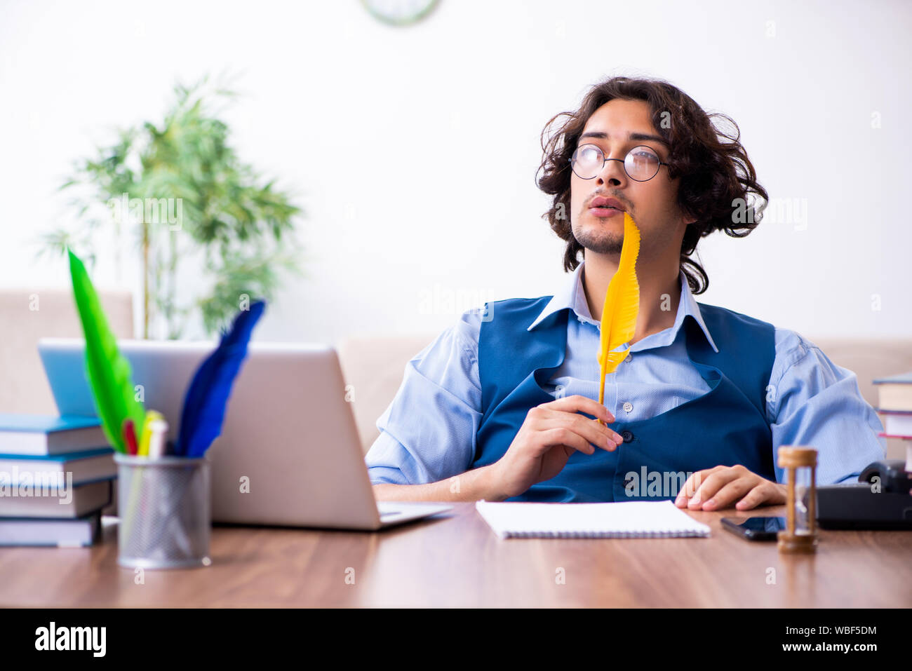 The young writer working on his new work Stock Photo - Alamy