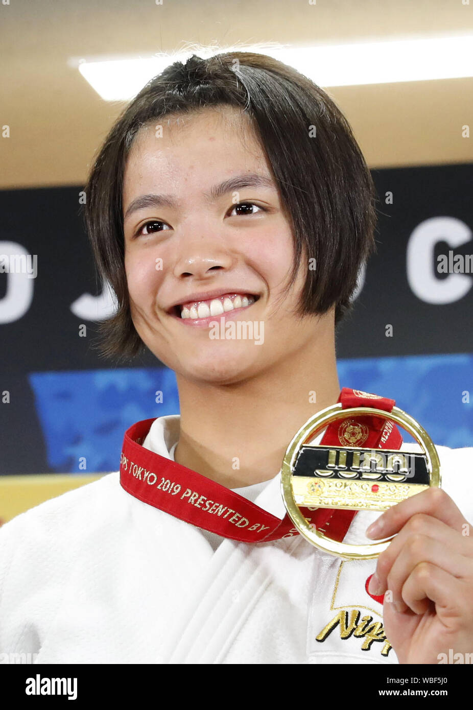 Uta Abe of Japan shows off her medal after retaining her women's 52 ...