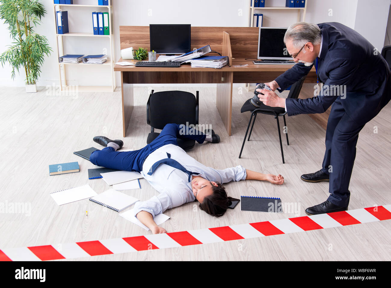The forensic investigator and dead employee in the office Stock Photo ...