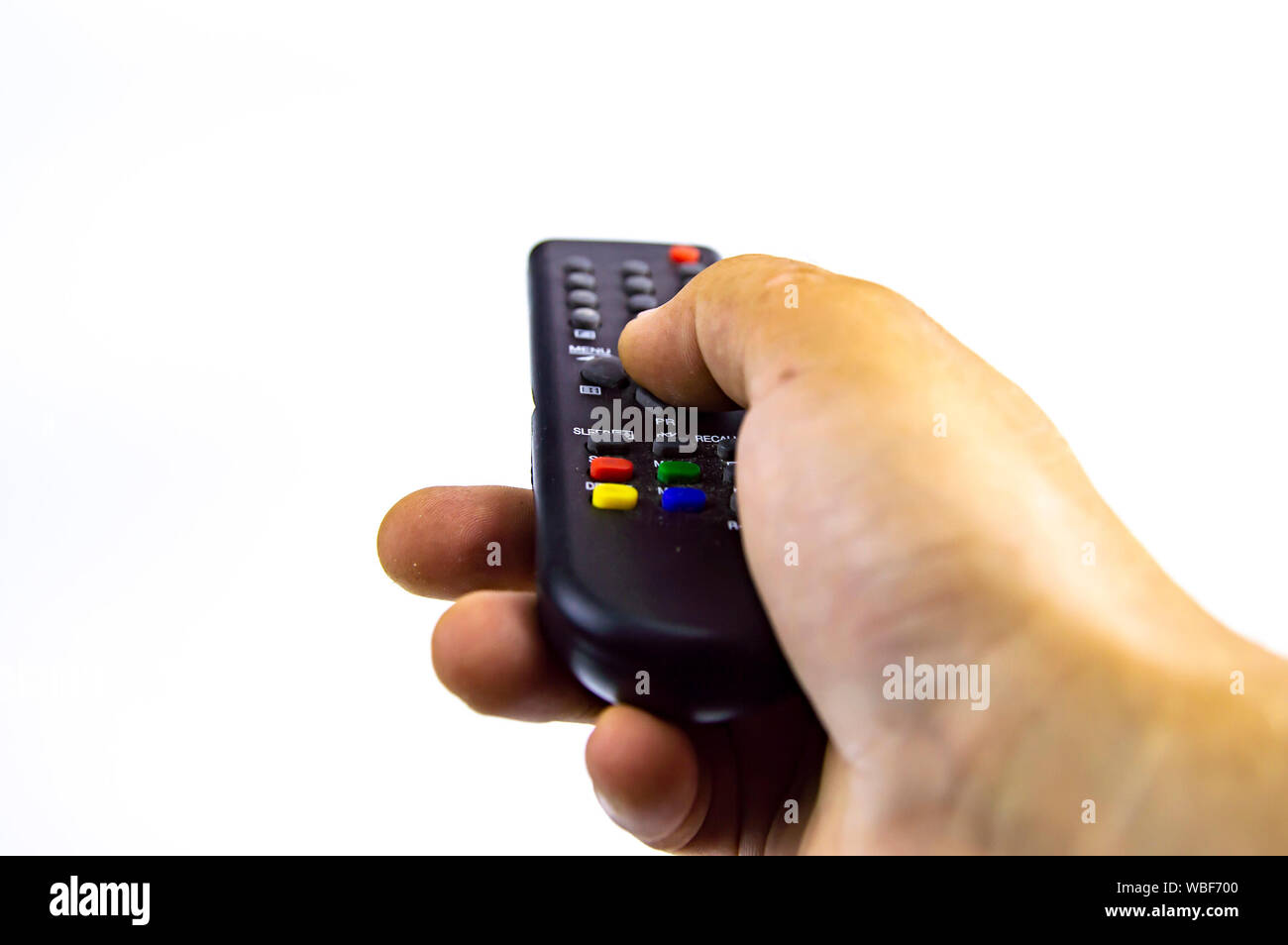 Remote tv remote in man's hand on a white background Stock Photo - Alamy