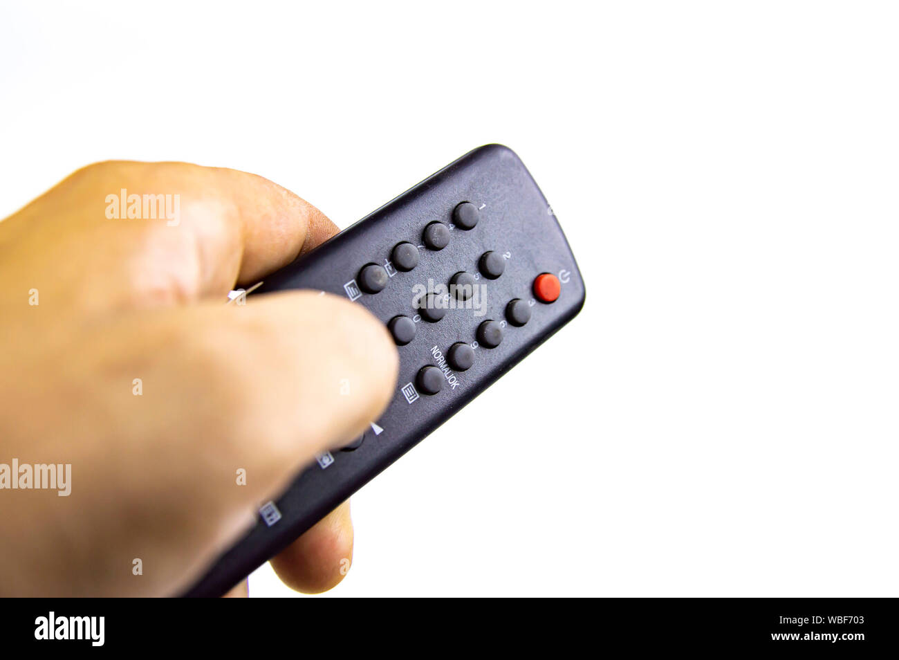 Remote tv remote in man's hand on a white background Stock Photo - Alamy