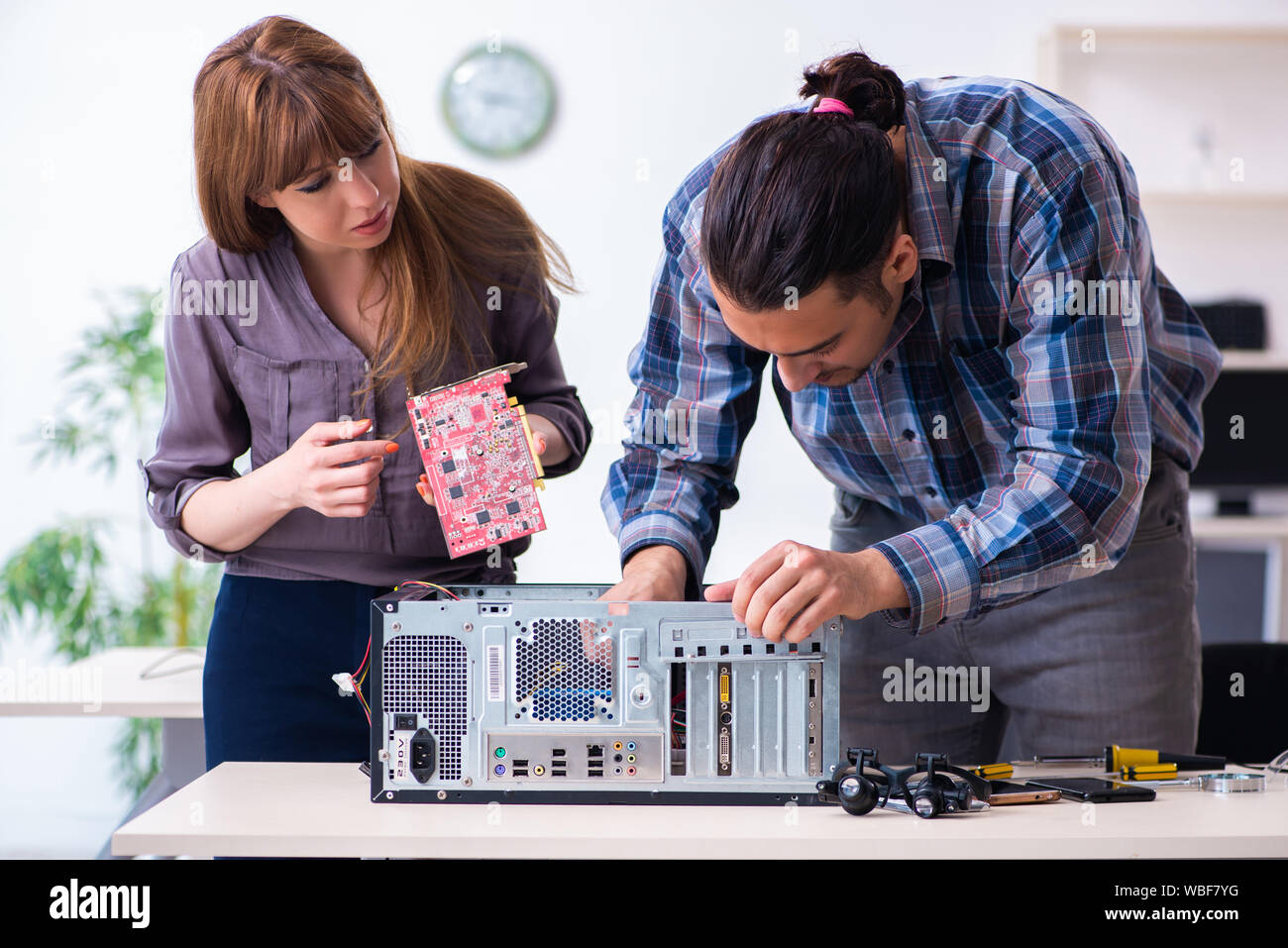 The two repairmen repairing desktop computer Stock Photo - Alamy