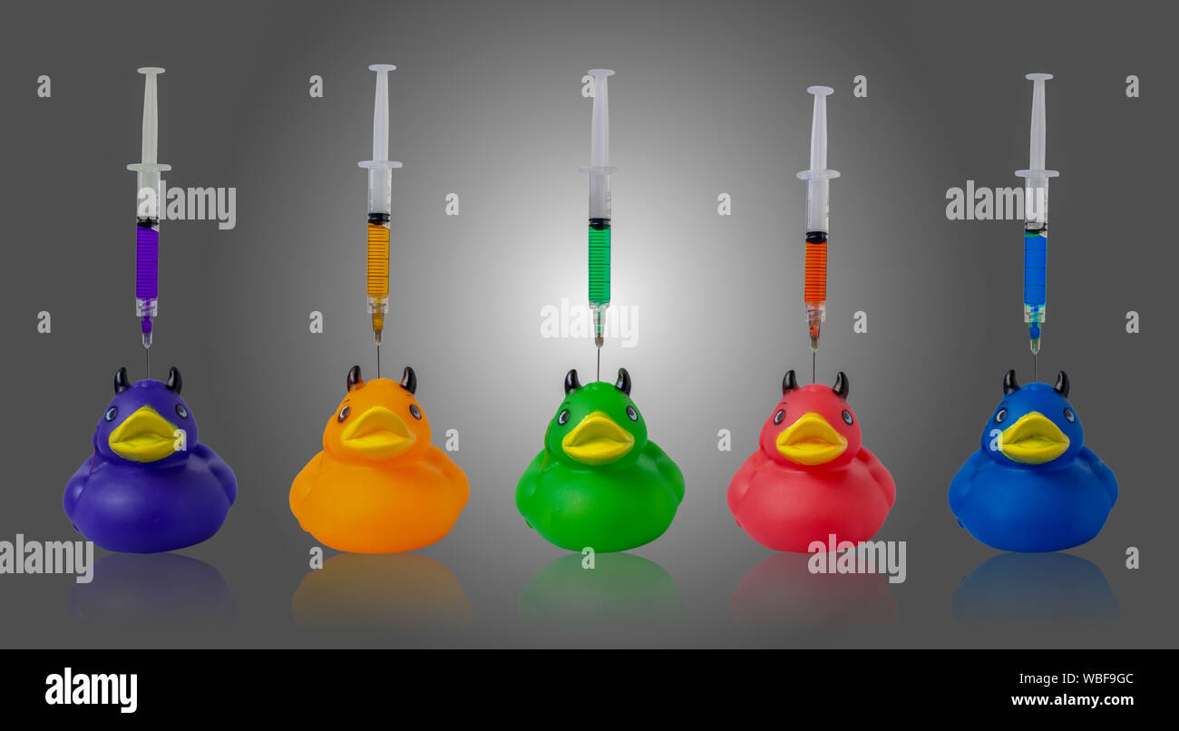Colored rubber duckies show how they get their color. Studio image. Mar ...