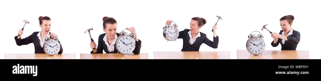 The woman desperate with time hitting clock with hammer Stock Photo - Alamy