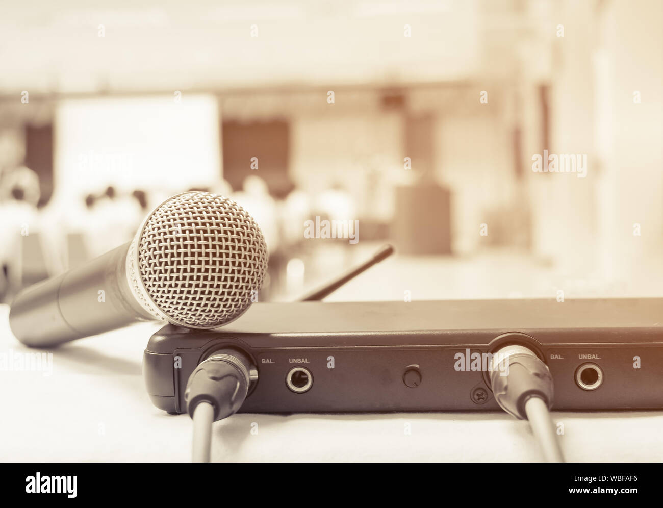Close up old microphone wireless with box signal on the white table in ...