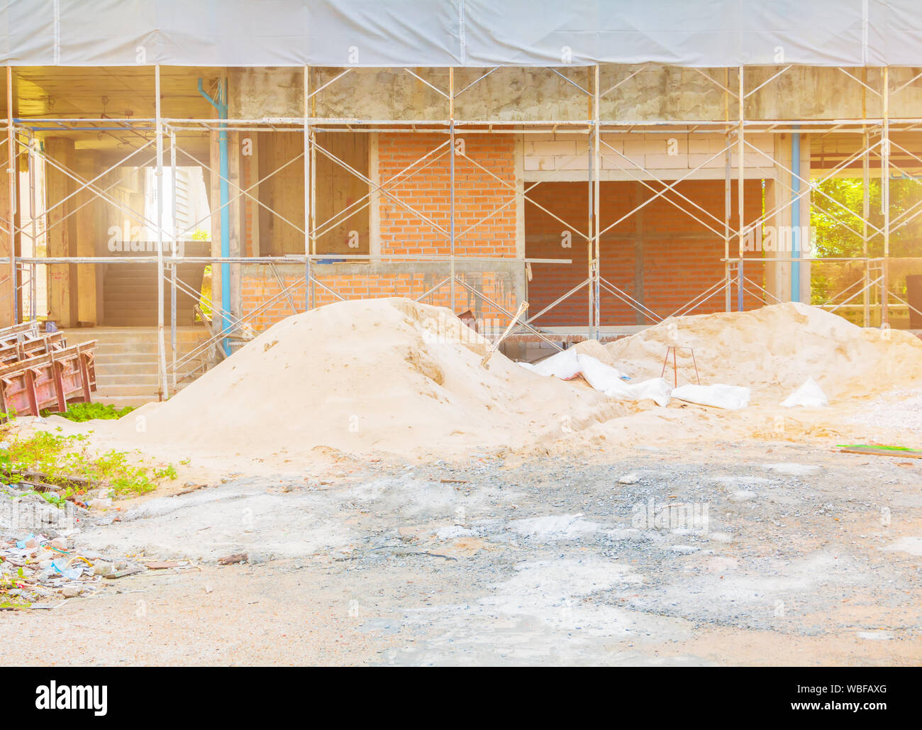 construction site housing building and sand heap in workplace with copy ...