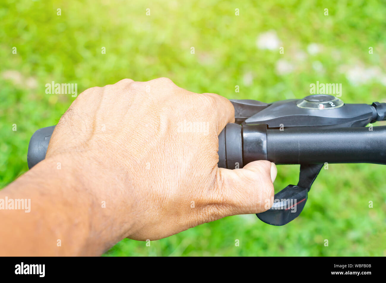 hand cyclist hold handle bike Stock Photo - Alamy