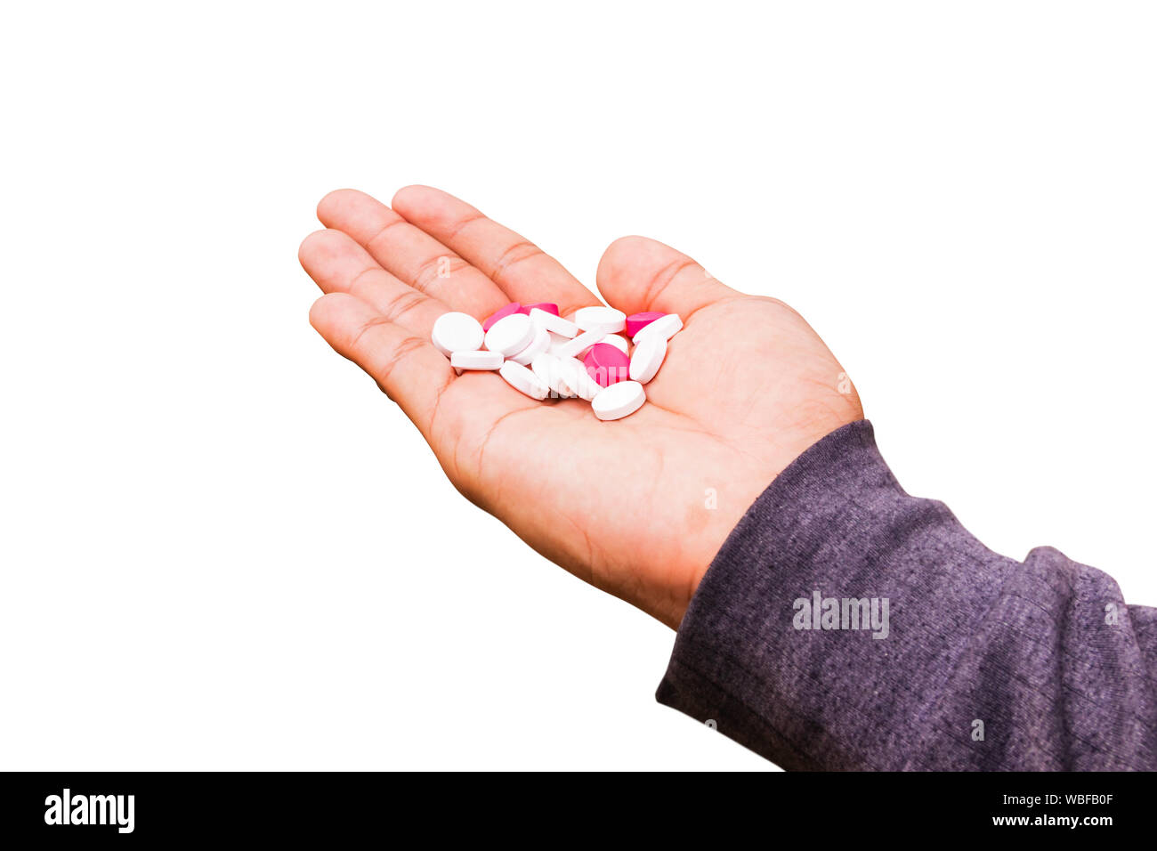 pills in hand male isolated on white background and clipping path. Stop ...
