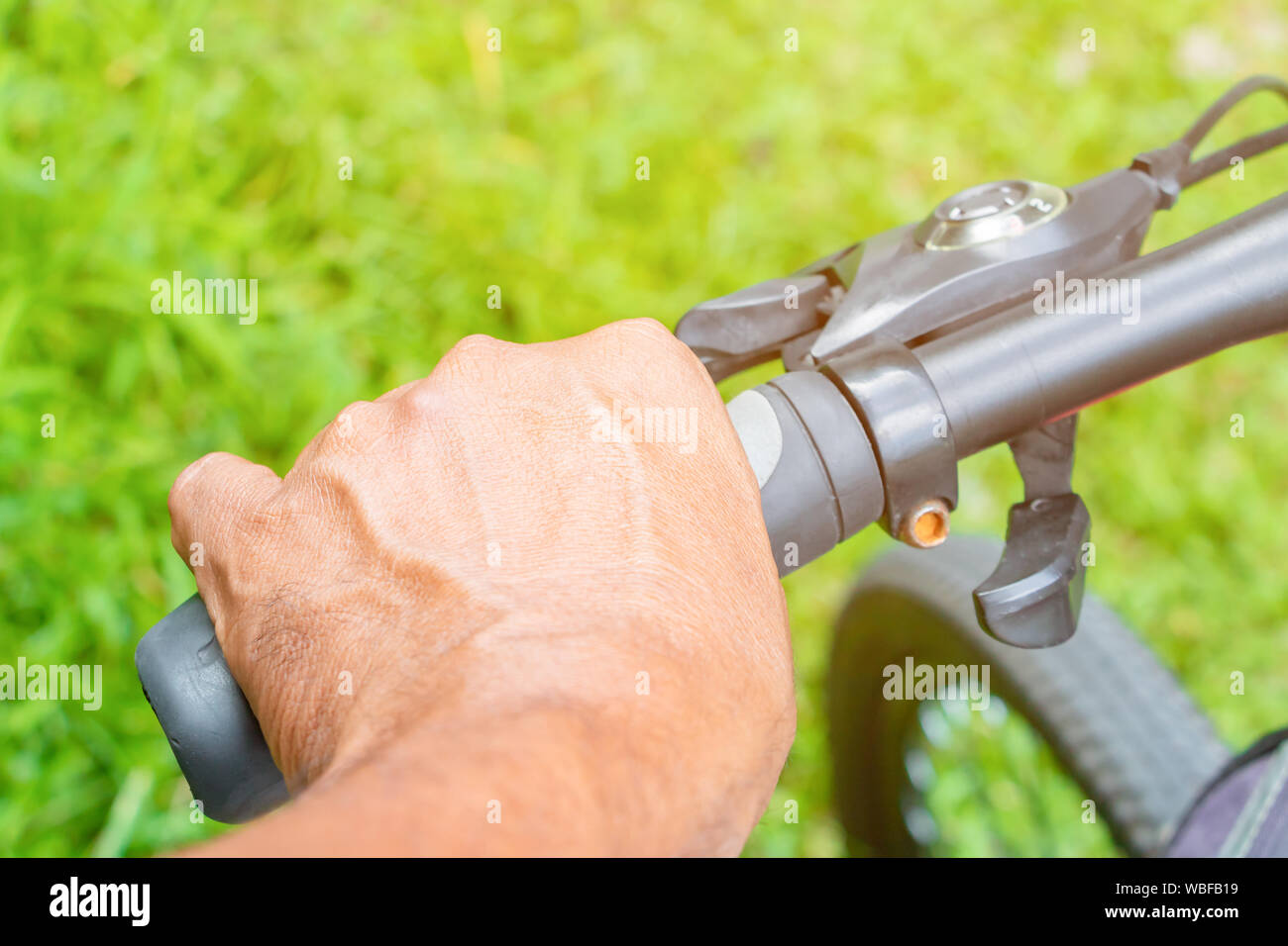 hand cyclist hold handle bike Stock Photo - Alamy