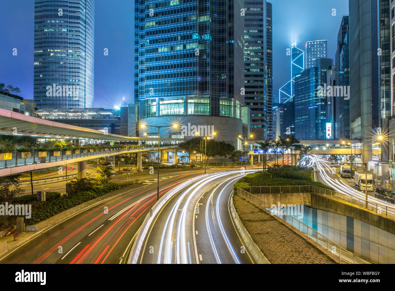 Busy street scene with traffic illuminated at night hi-res stock ...
