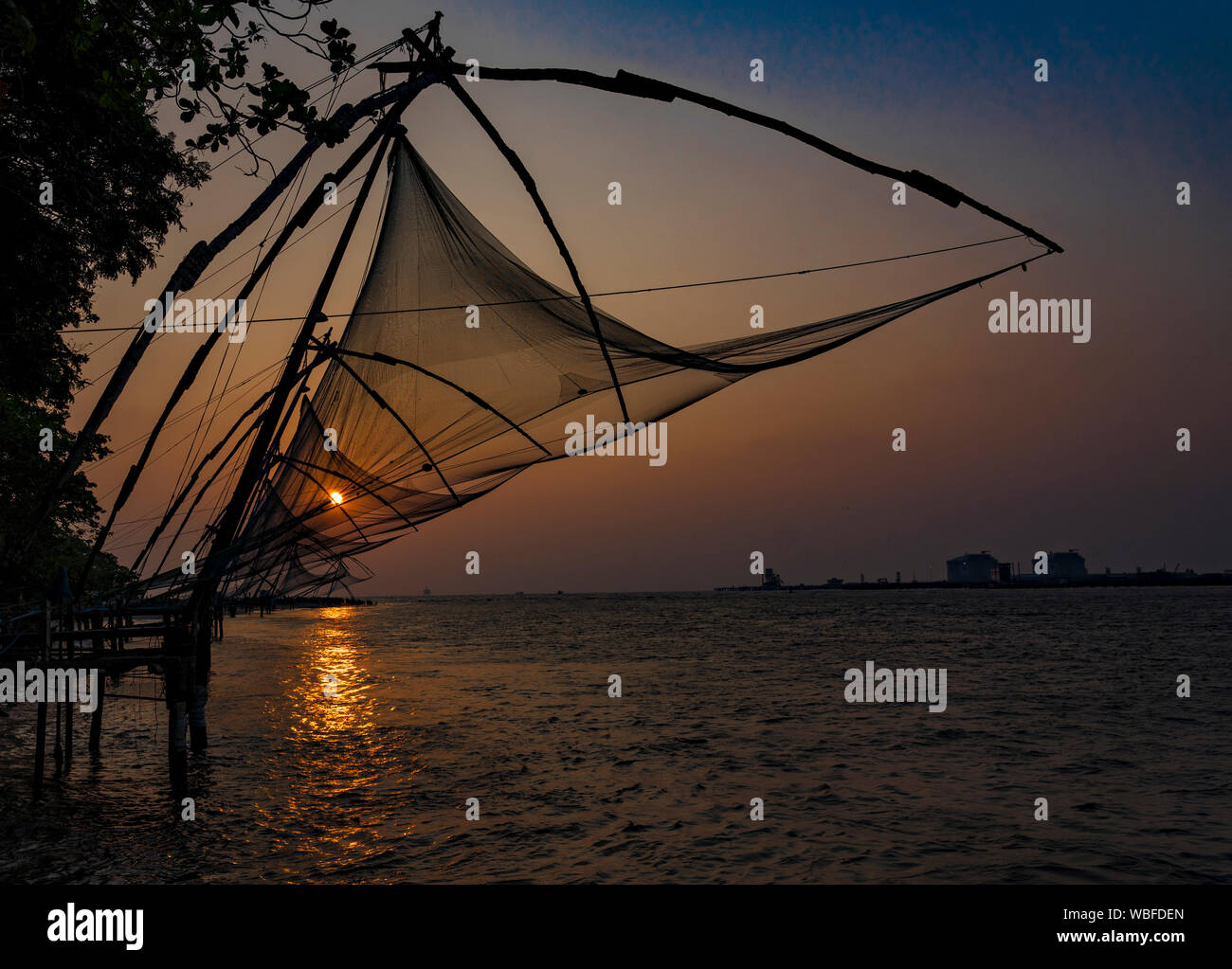 Fisherman nets at the sunset in kerala hi-res stock photography and ...