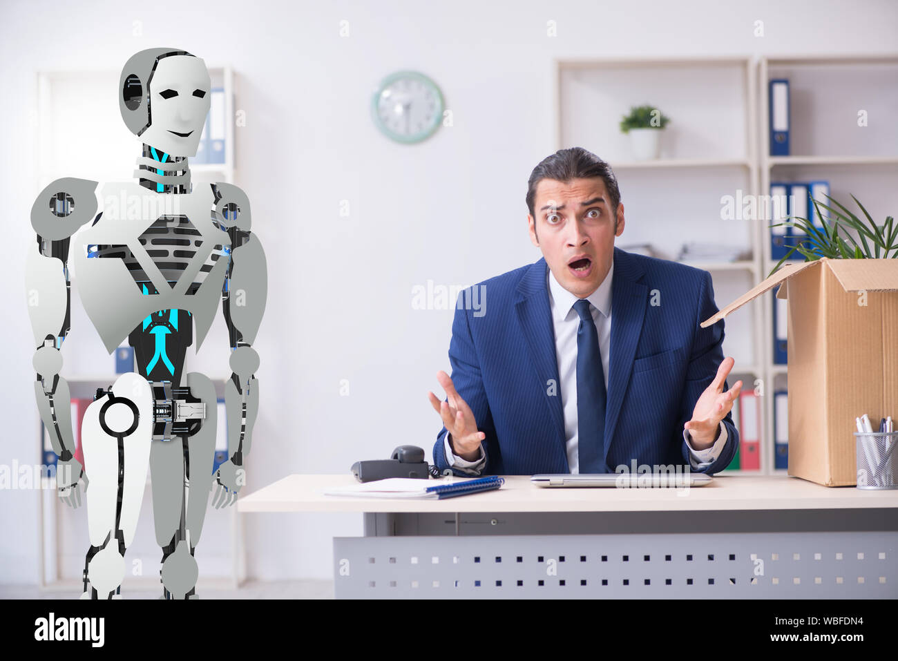 The concept of robots replacing humans in offices Stock Photo - Alamy