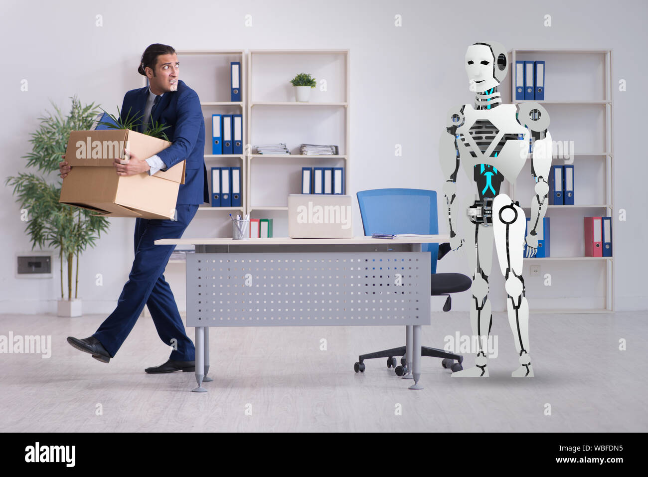 The concept of robots replacing humans in offices Stock Photo - Alamy