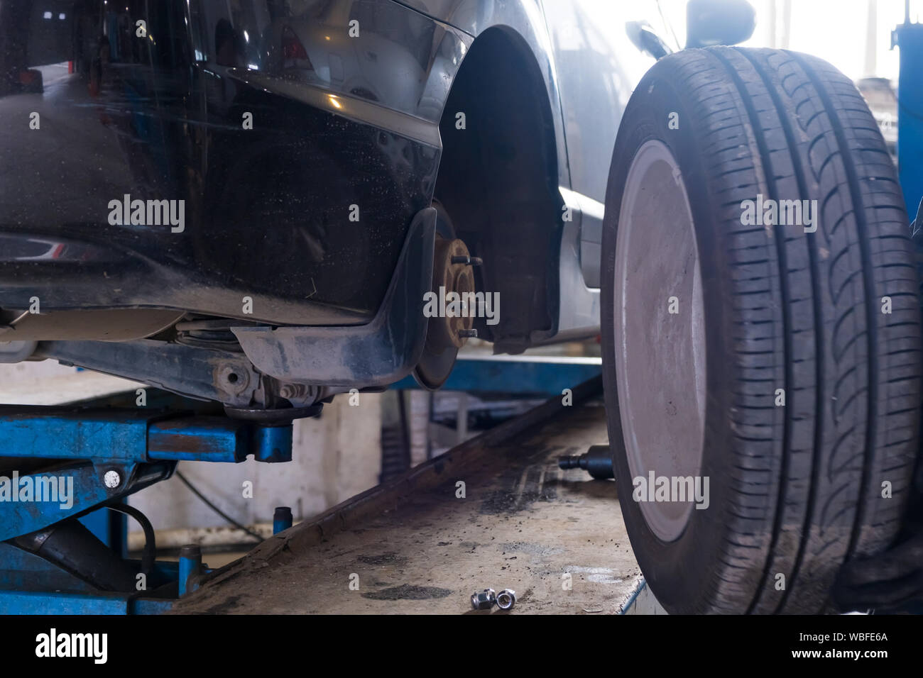 Tire fitting in a repair garage. replacement of winter and summer tires ...