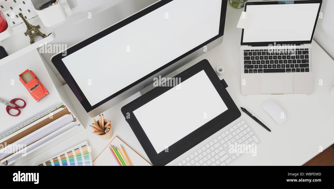 Top view of graphic designer workplace with blank screen tablet and ...