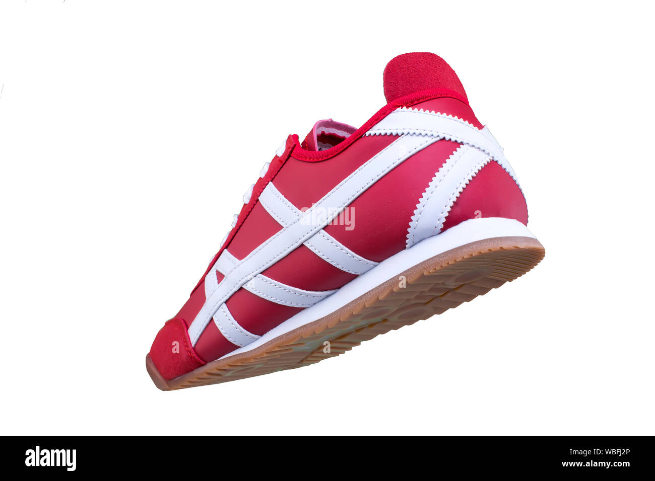Red sneaker with white stripes on a white background. Sport shoes Stock ...