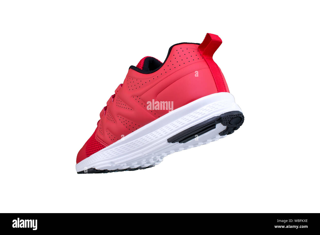 Red sneaker against white background. Sport shoes Stock Photo - Alamy