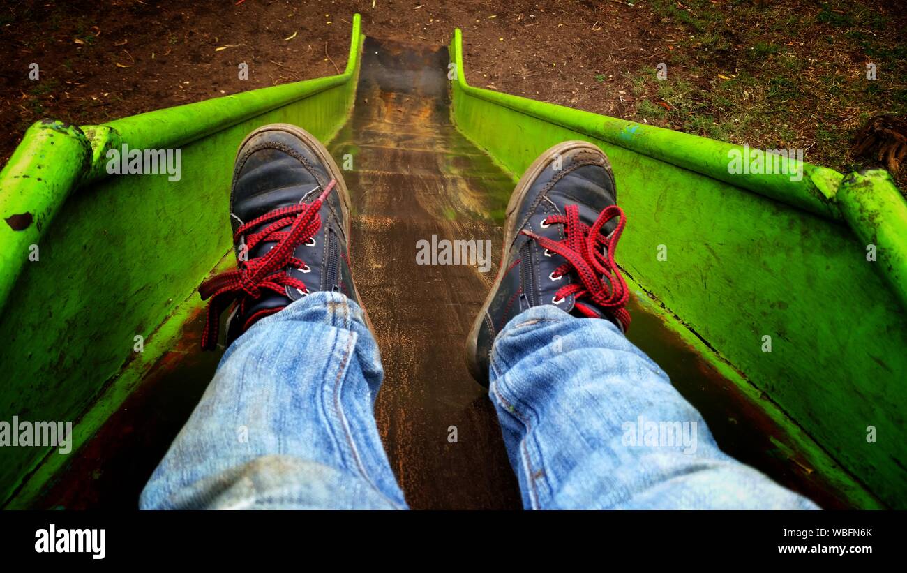 Man playground slide hi-res stock photography and images - Alamy
