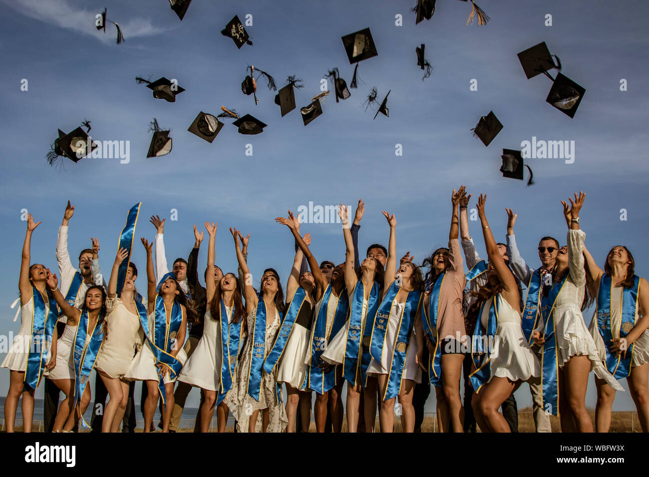 College students graduation caps air hi-res stock photography and ...