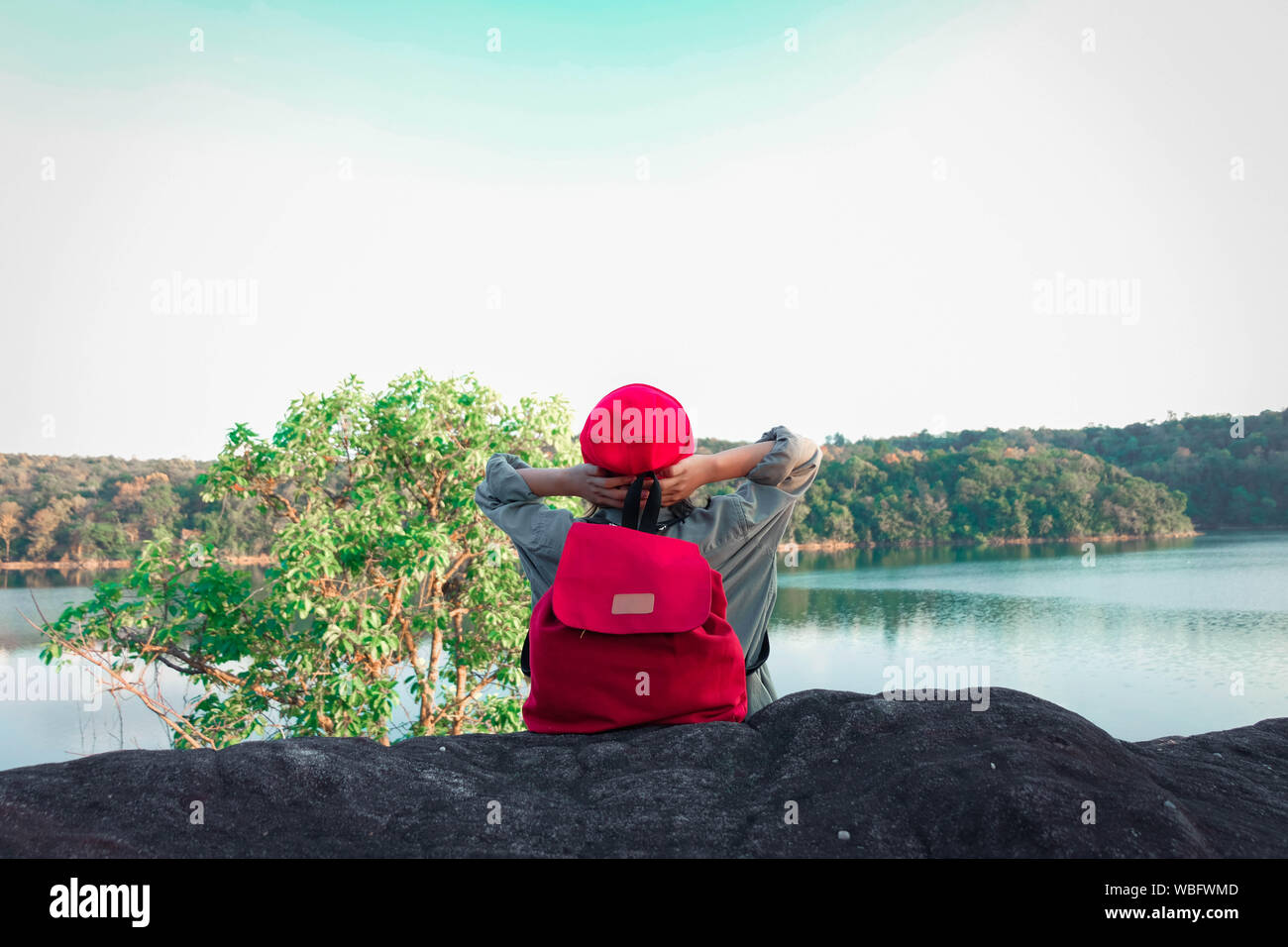 Female leaning against rock hi-res stock photography and images - Alamy
