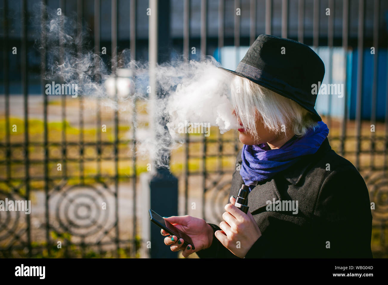 Standing holding communication smoking issues hi-res stock photography ...