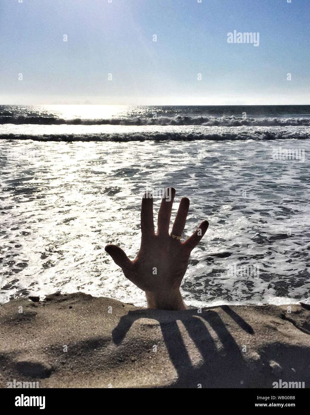 Hand emerging from sky hi-res stock photography and images - Alamy