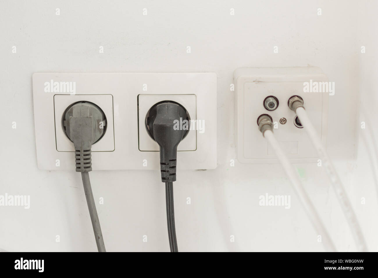 White socket on a white background with cable insert. Electricity ...