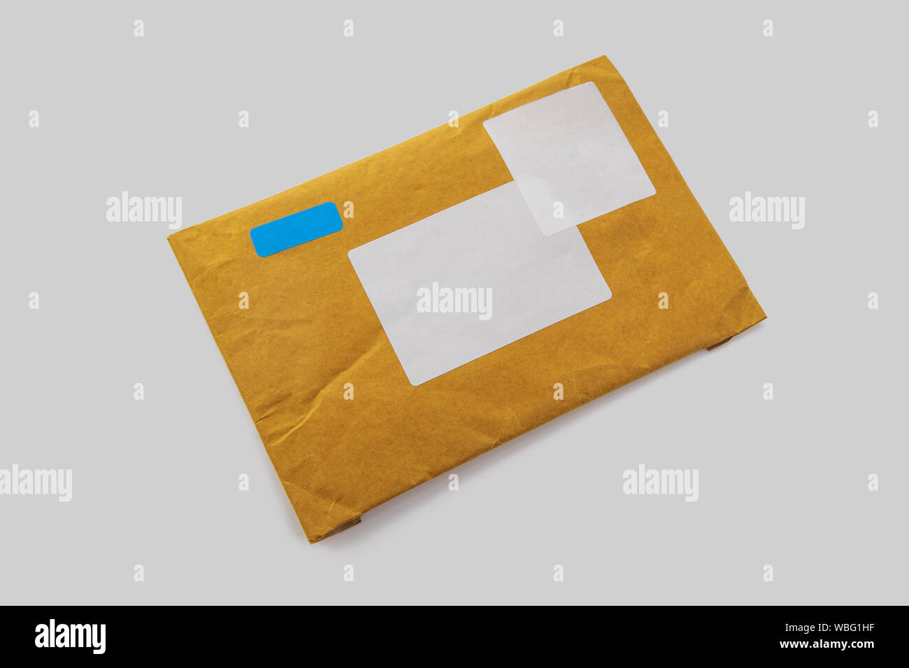 Small paper post packet isolated on the white background. Blank ...