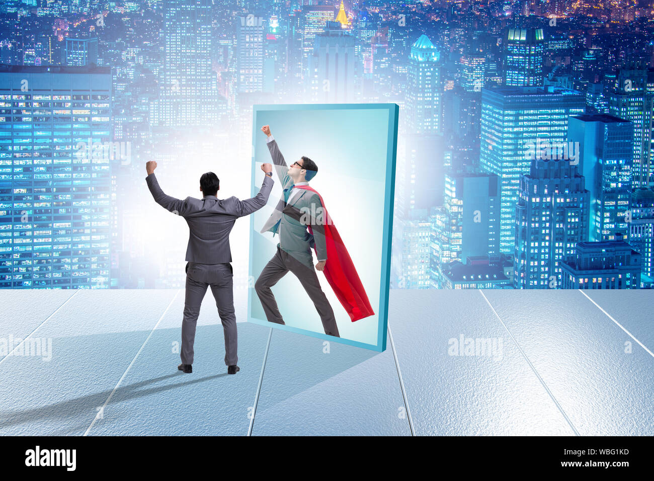 The businessman seeing himself in mirror as superhero Stock Photo - Alamy