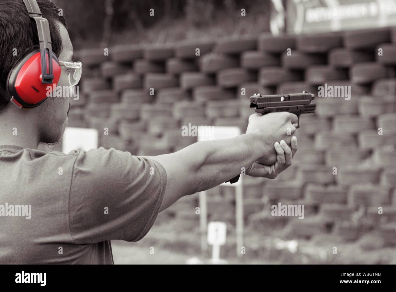 Young man aiming gun hi-res stock photography and images - Alamy