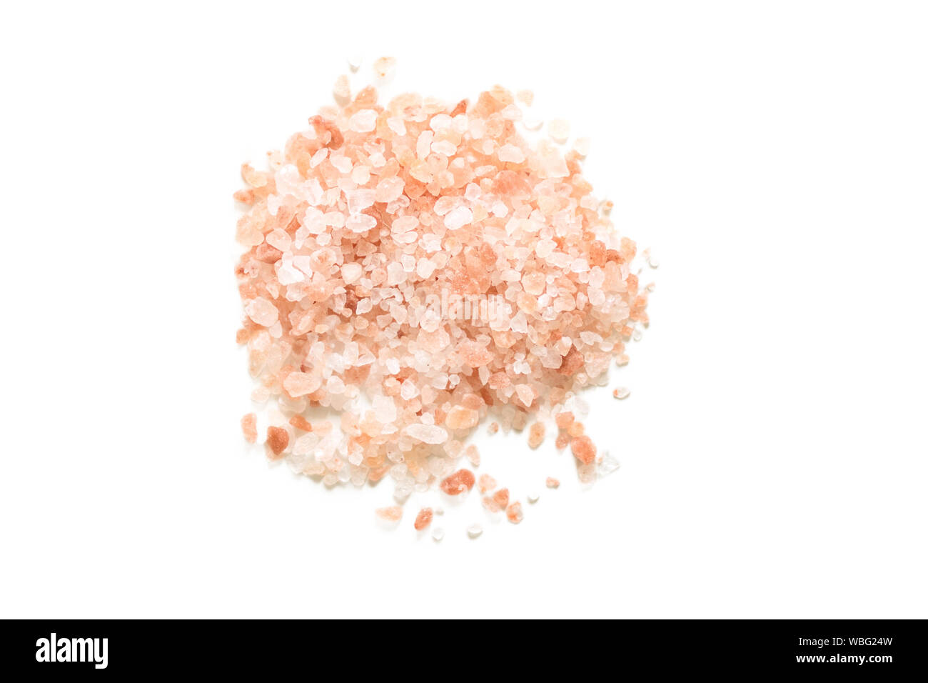 A pile of pink sea salt isolated on white background. Hip of red ...