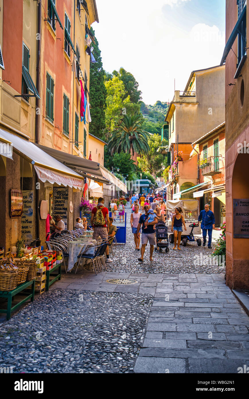 Portofino, Italy - AUGUST 15, 2019: People walking along small strees ...