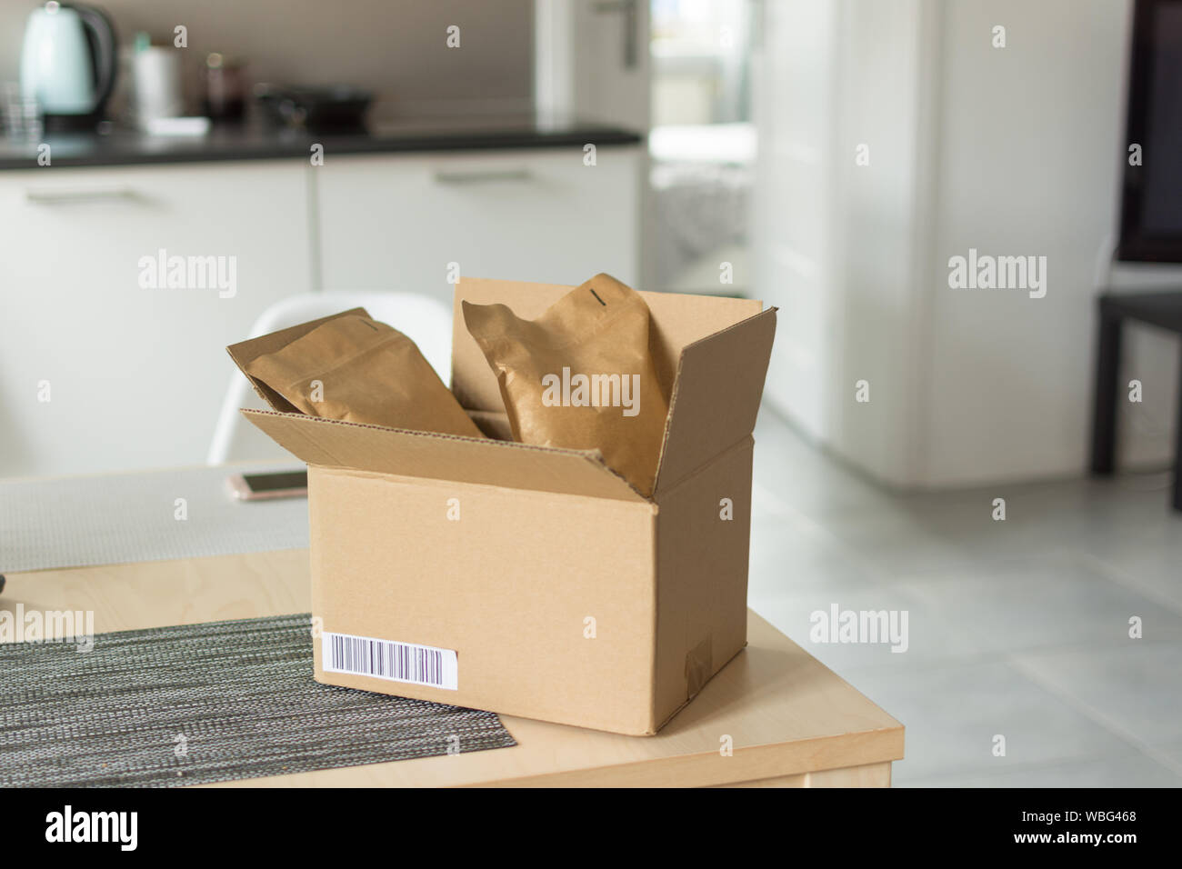 Opened cardboard over modern interior. Paper parcel opened indoors ...