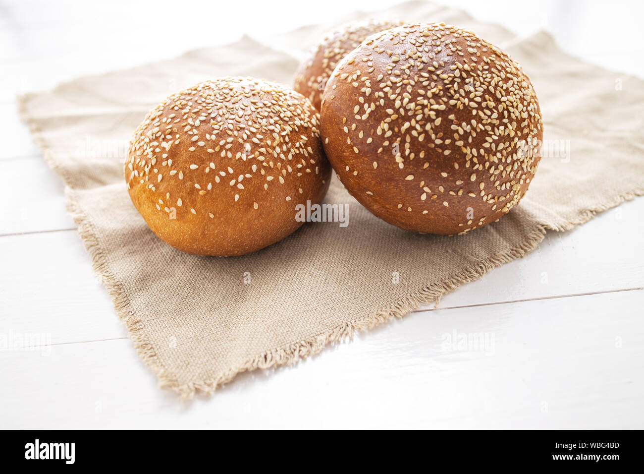 Homemade sourdough bread. Burger bun isolated on white background Stock ...