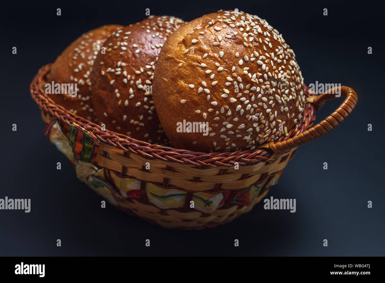 Homemade sourdough bread. Burger bun isolated on black background Stock ...
