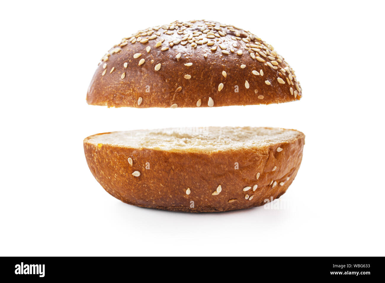 Homemade sourdough bread. Burger bun isolated on white background Stock ...