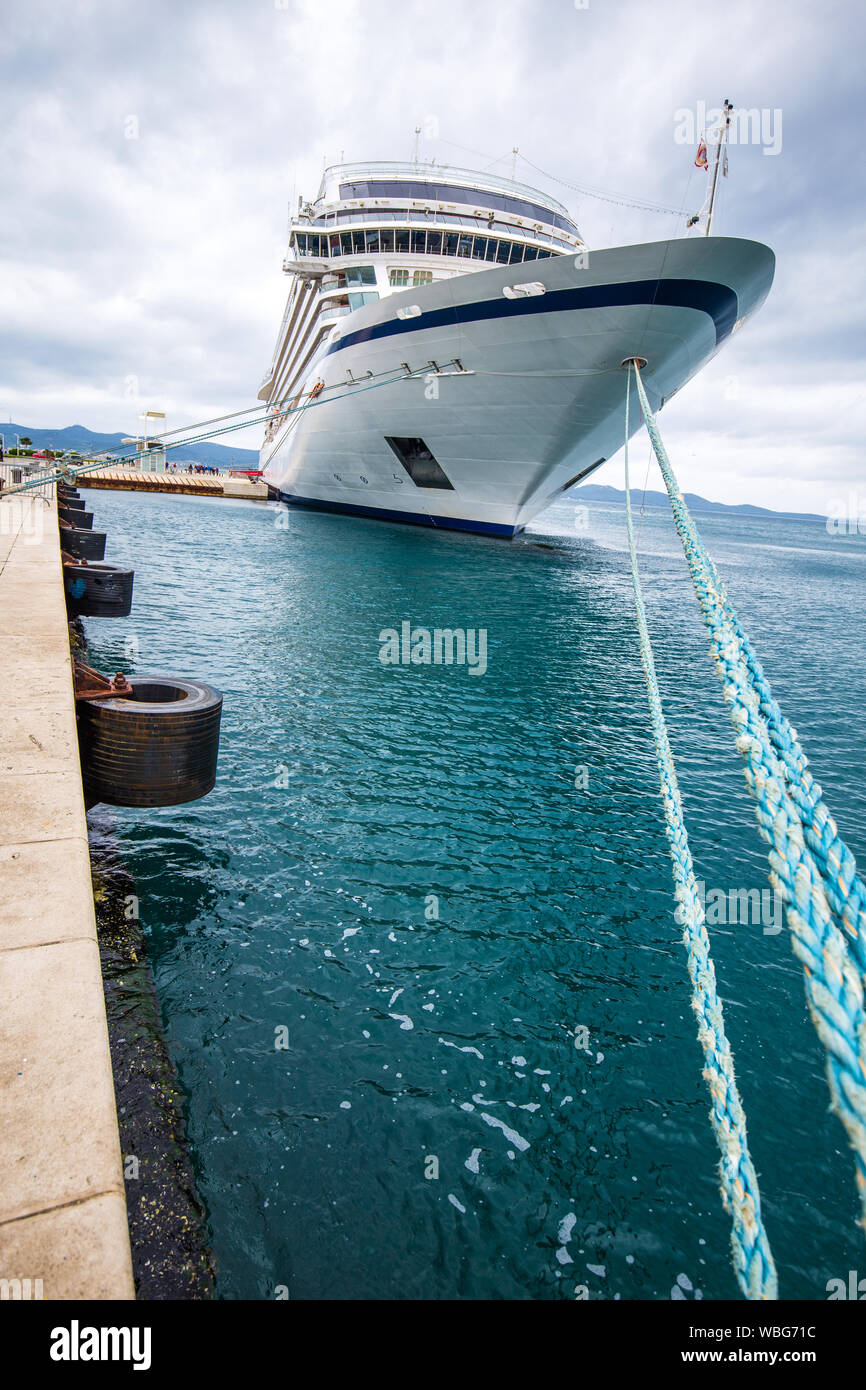 09 May 2019. Cruise ship docked with the mooring lines attached to the ...