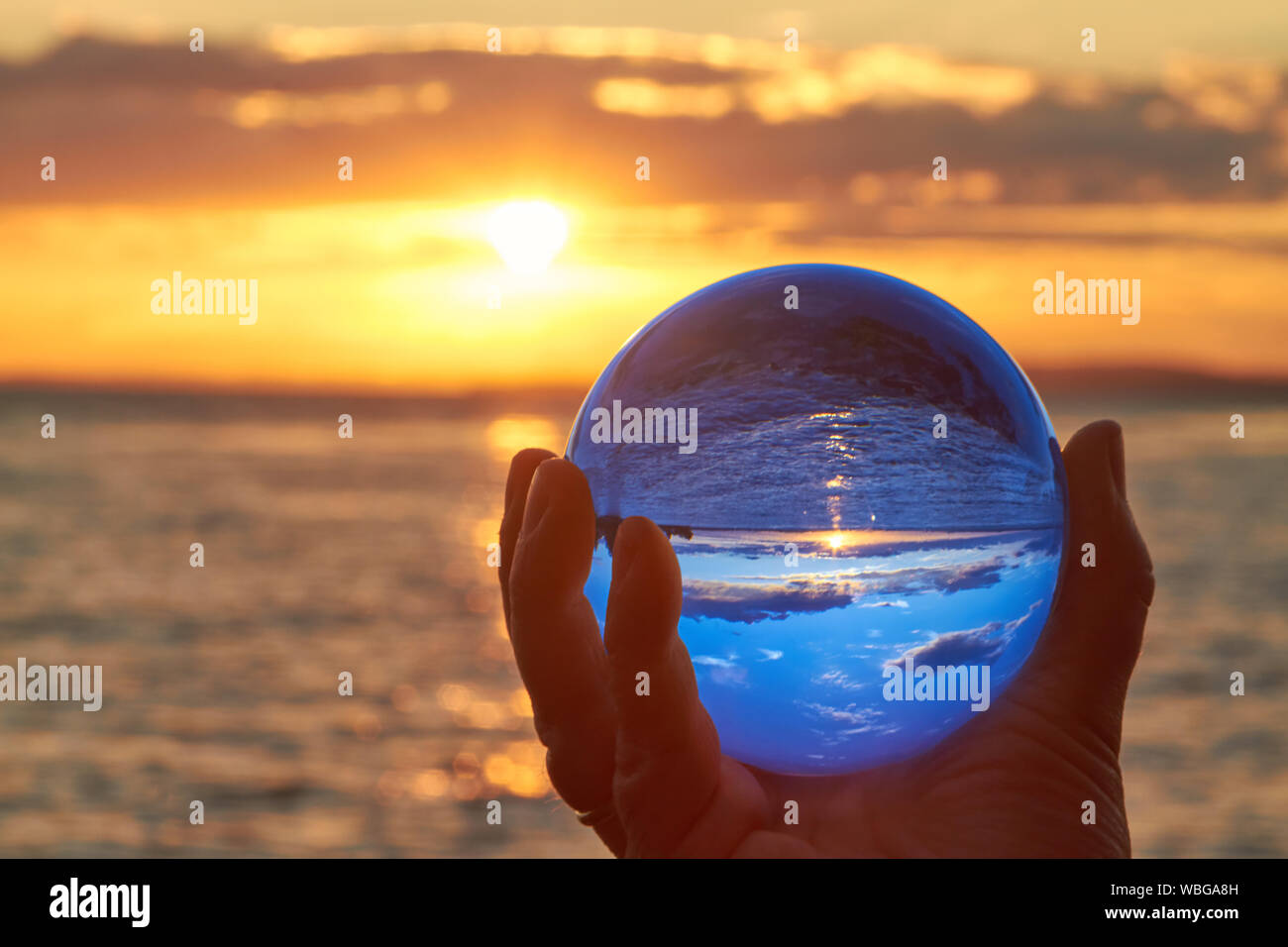 Man holding crystal ball hi-res stock photography and images - Alamy