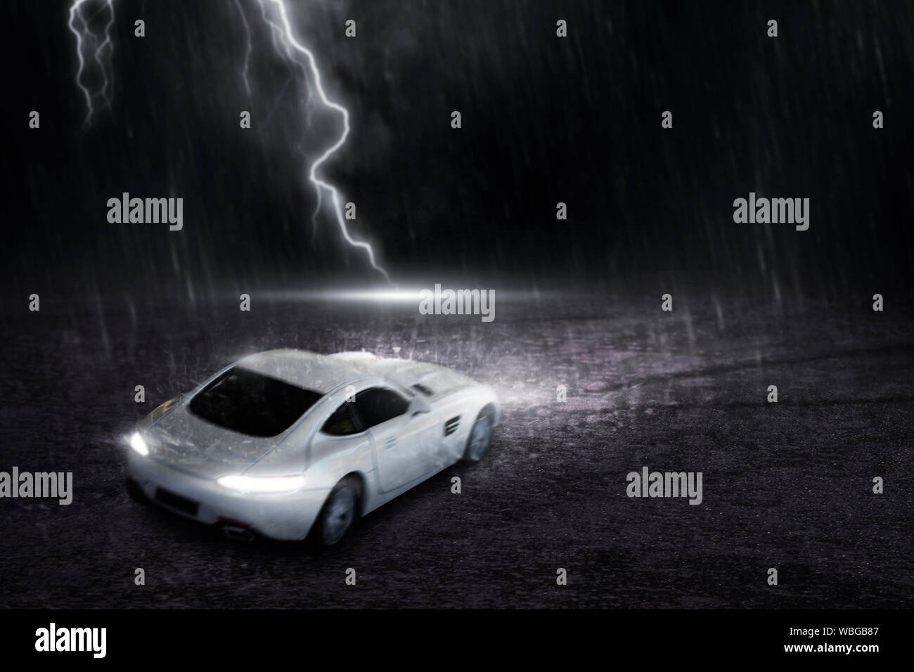 The white sports car that focuses on the back, runs on a road with rain ...