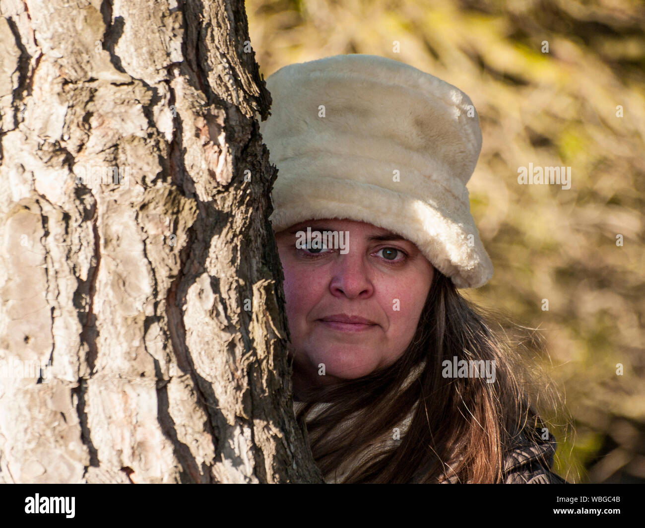 Portrait behind trunk hi-res stock photography and images - Alamy