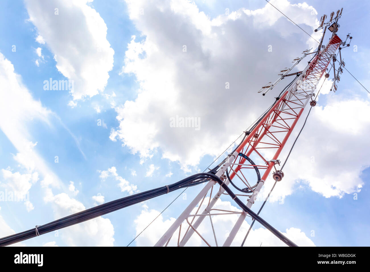 Television antennas on the rooftop with sky and cloudy background. copy ...