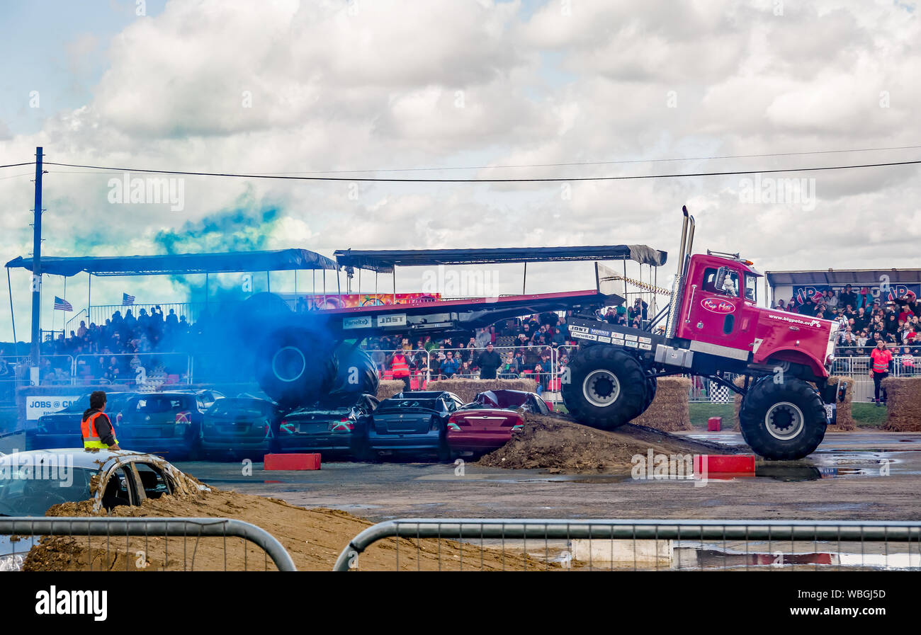 The monster truck Big Pete crushing a car stack whilst towing a bespoke ...