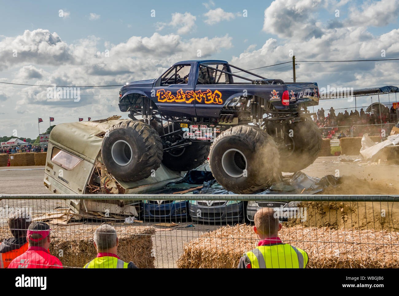 The Blaster monster truck jumping through a disused caravan destroying ...