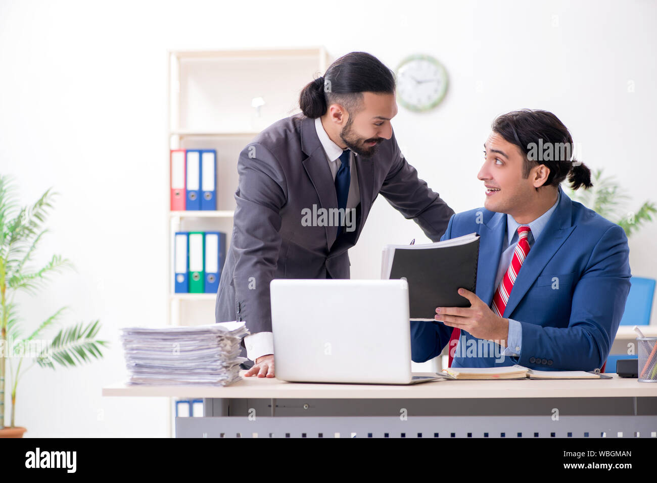 The two male colleagues in the office Stock Photo - Alamy