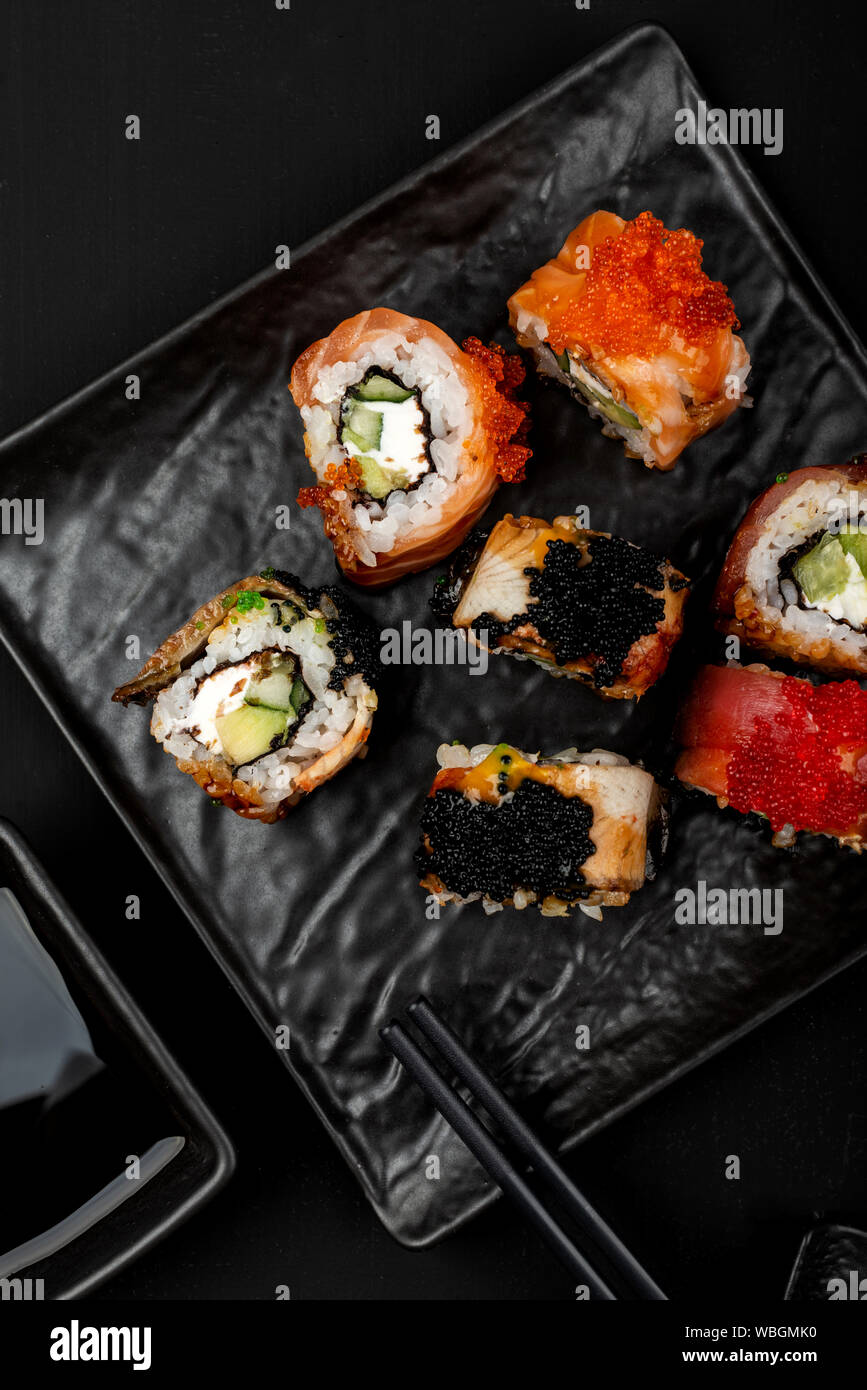 Set of sushi rolls on stone table. Top view with copy space Stock Photo ...