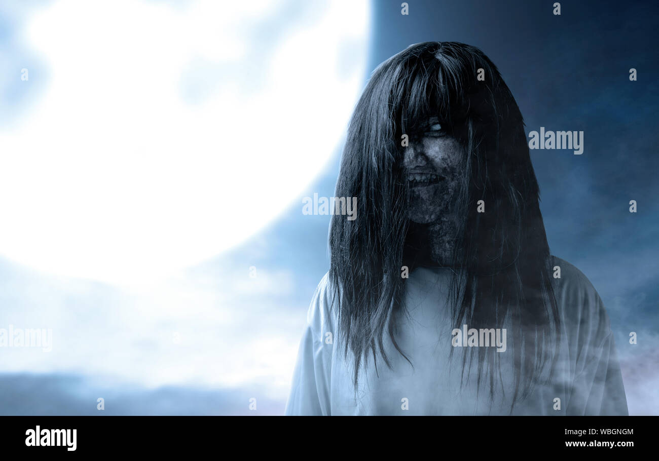 Scary ghost woman with blood and dirty face standing with moonlight ...